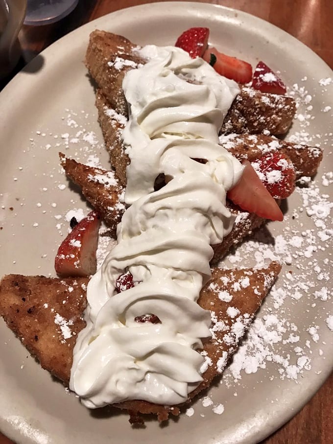 This isn't just French toast&mdash;it's a sweet revelation with powdered sugar snow and berry accents. Your diet plan's worst nightmare and your taste buds' dream come true.