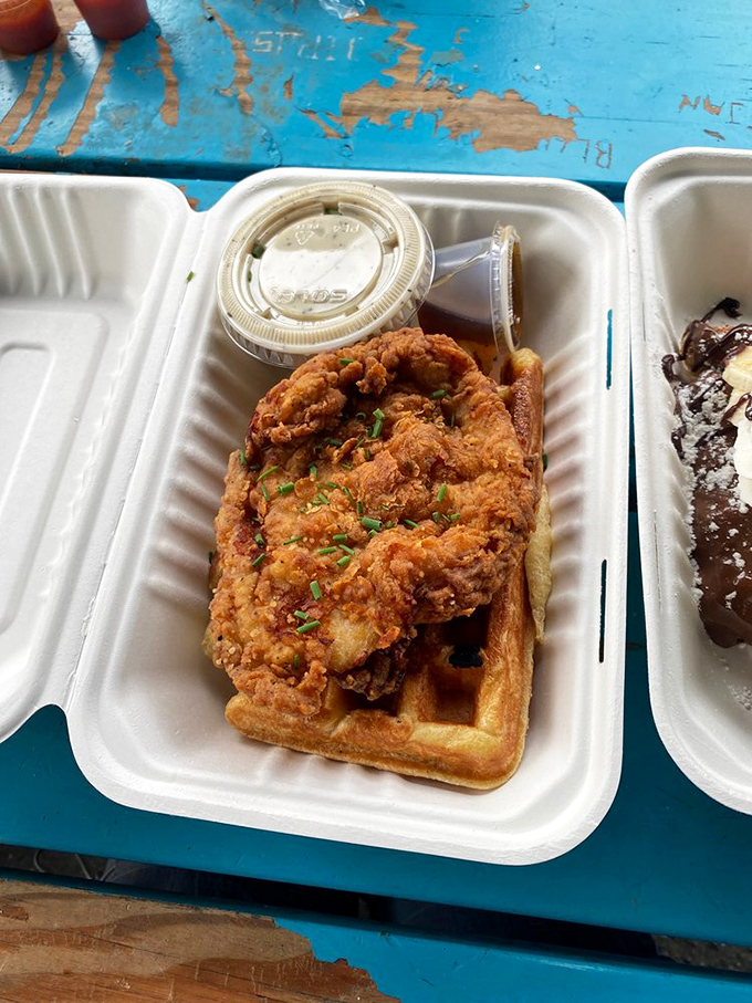 Served in a to-go container but deserving of fine china&mdash;this chicken and waffle combo doesn't just raise the bar, it is the bar.
