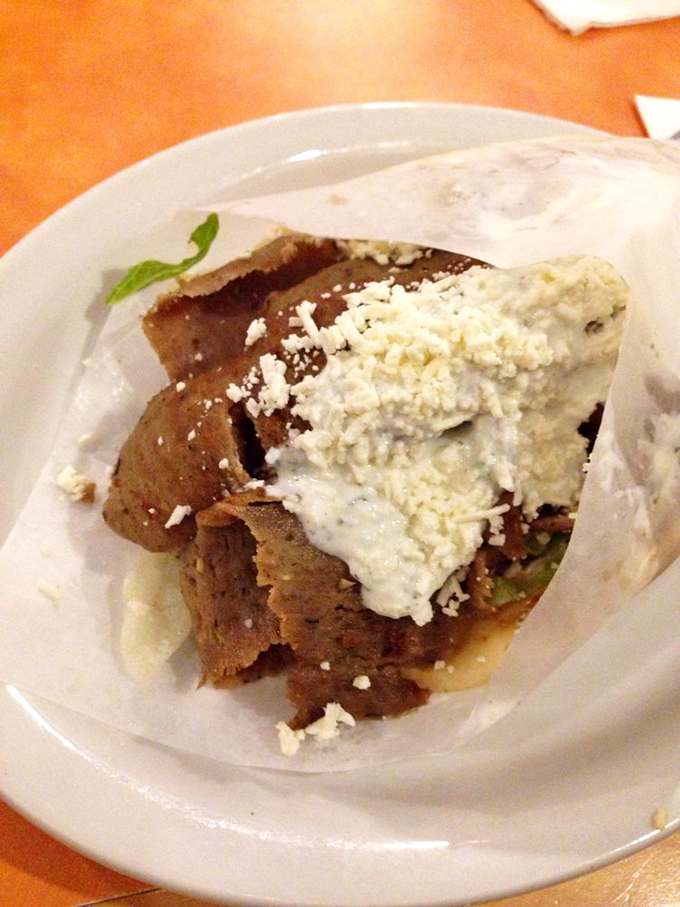 Some restaurants hide their best dishes as specials. At Gyro House, the star of the show proudly takes center stage in all its tzatziki-drizzled glory.