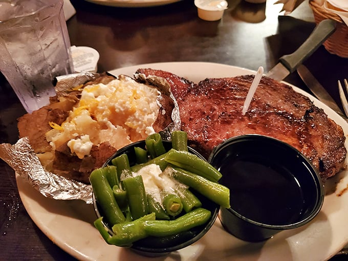 That loaded baked potato alongside a medium-rare steak is the kind of pairing that makes you believe in true love. Simple perfection on a plate.