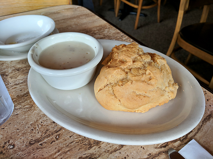 The humble biscuit, elevated to art form. Fluffy, substantial, and ready to soak up every drop of that accompanying gravy.