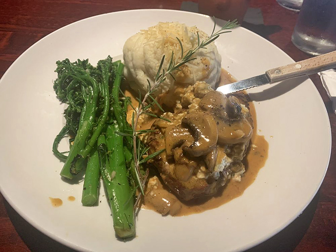 Treat yourself to this savory steak topped with creamy mushroom sauce, fluffy mashed potatoes, and perfectly seasoned greens for dinner tonight.