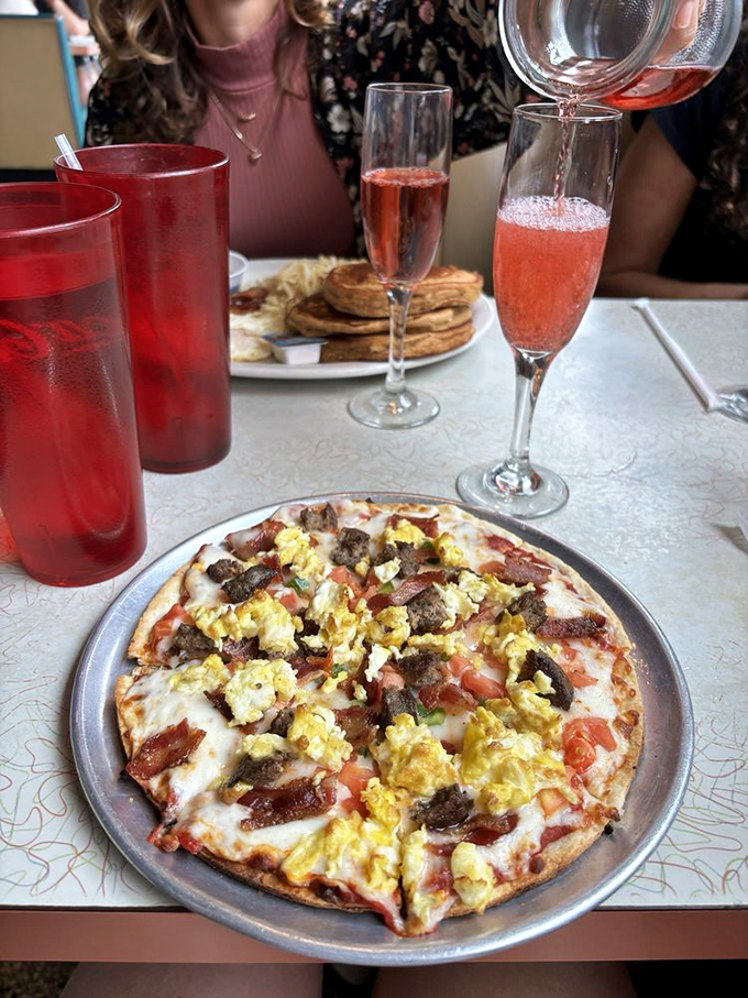 Who said pizza can't be breakfast? This masterpiece topped with eggs, cheese and breakfast meats makes morning meetings infinitely more bearable.