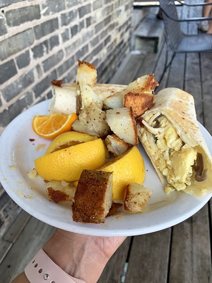 Breakfast burrito meets roasted potatoes in a plate that says, "Go ahead, cancel your lunch plans. I'm all you need today."