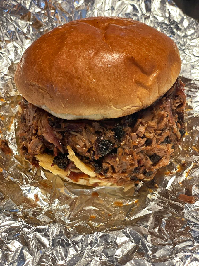 This isn't just a sandwich&mdash;it's an architectural marvel of chopped brisket, perfectly balanced between soft bun and crunchy slaw. Napkins: mandatory. 
