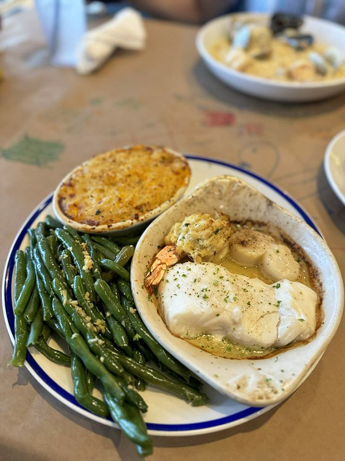 A seafood medley that makes choosing unnecessary. Green beans on the side pretending they're the main attraction&mdash;bless their hearts.