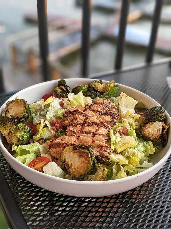 A salad that actually satisfies – crisp greens, perfectly charred brussels sprouts, and grilled chicken playing in perfect harmony like a culinary jazz quartet.