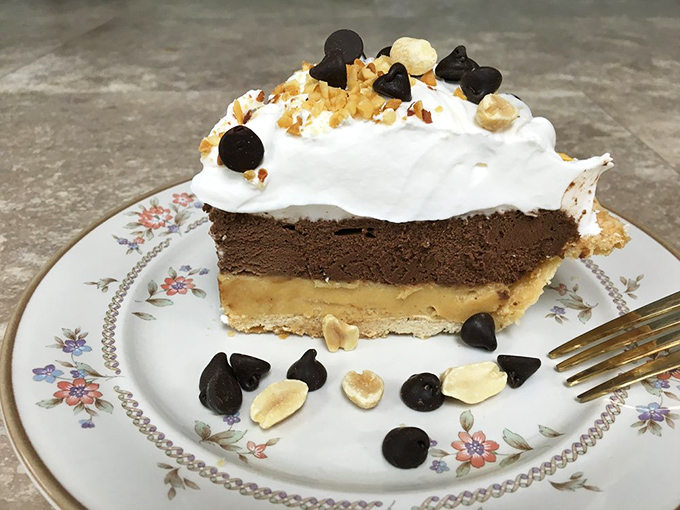 The Buckeye pie—where chocolate and peanut butter perform their perfect dance. Ohio's favorite flavor combination elevated to art form.