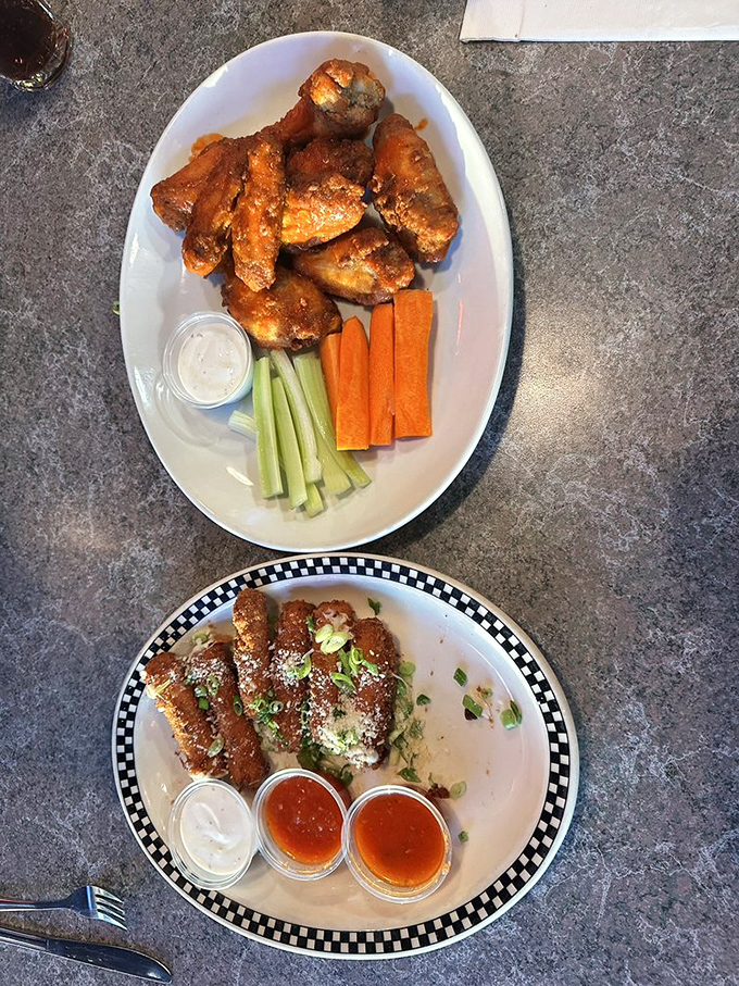 Two American classics sharing one plate&mdash;crispy wings bringing the heat while mozzarella sticks cool things down. A peaceful coexistence of fried delights.