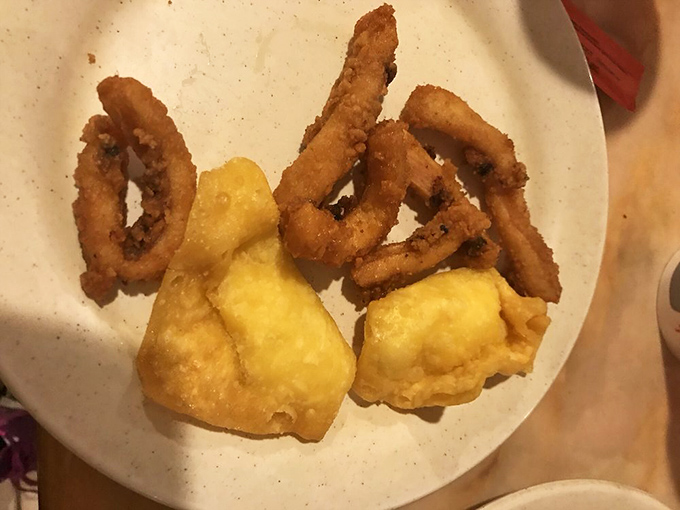 Crispy calamari rings and golden crab puffs&mdash;the dynamic duo of fried seafood that makes you wonder why you ever bothered with salad. 