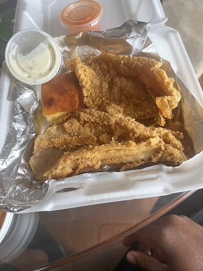 Crispy catfish that would make a pescatarian weep with joy, served with sides that refuse to be upstaged.