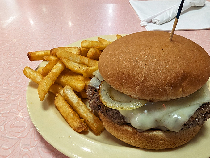 This isn't just a burger&mdash;it's architecture. Golden fries, perfectly melted cheese, and a bun that somehow contains all that deliciousness without surrendering.