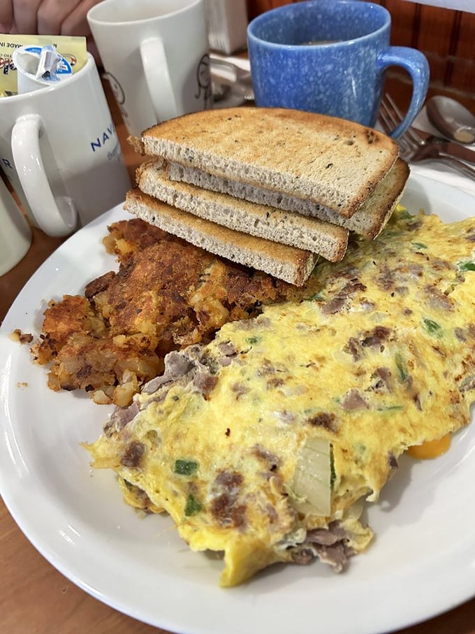 This isn't just an omelet&mdash;it's a fluffy yellow tent housing a convention of perfectly saut&eacute;ed ingredients