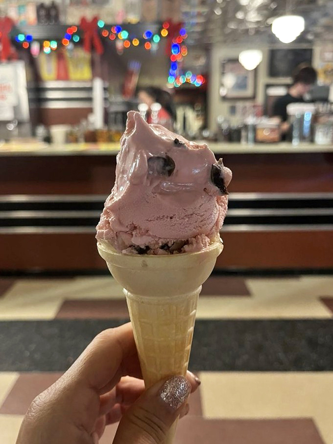 The neon sign speaks truth: if it's Borden's, it's guaranteed to transform any bad day into something worth celebrating.