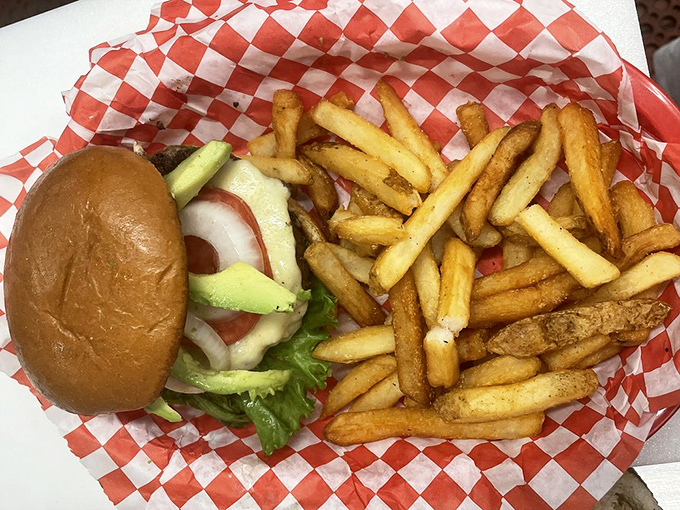 This burger doesn't need fancy aioli or artisanal buns &ndash; just honest ingredients and those perfectly golden fries that disappear way too quickly.
