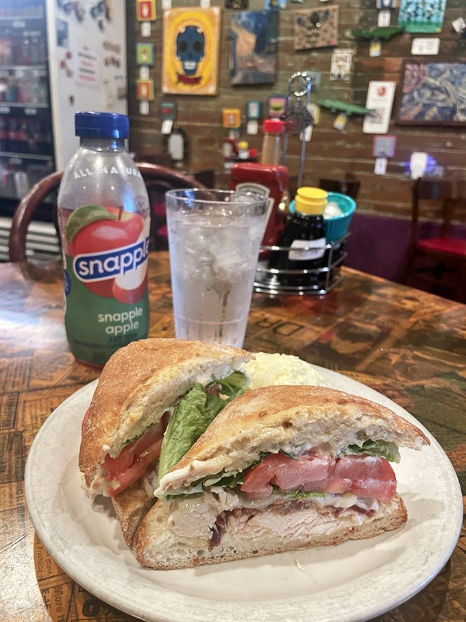 This sandwich isn't just lunch, it's architecture&mdash;layers of turkey, tomato, and lettuce creating the Taj Mahal of midday sustenance.