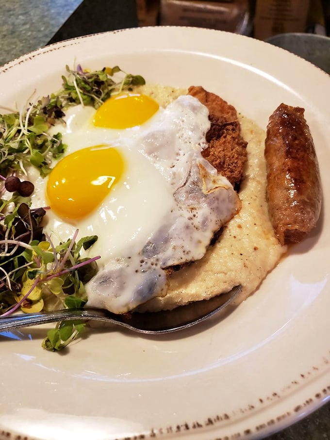 Breakfast nirvana achieved: sunny-side-up eggs crowning chicken fried steak over creamy grits with a sausage sidekick. Morning meals don't get more Maryland-meets-Southern than this.