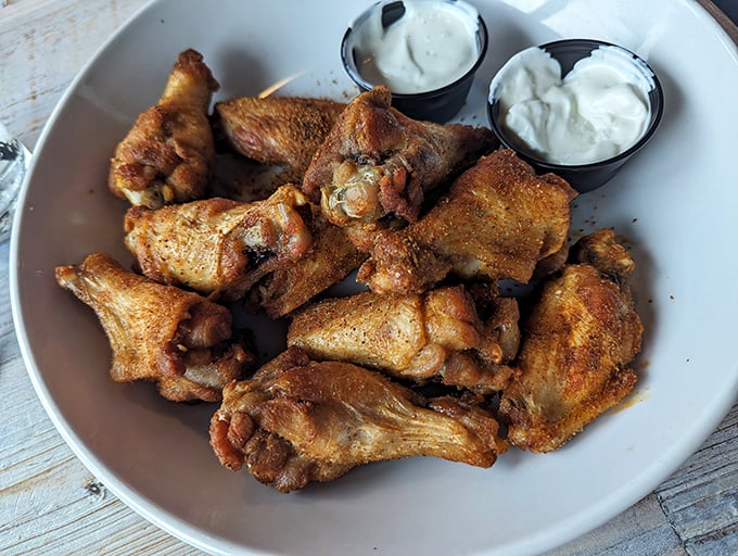 Wings so perfectly crispy they make that potato chip slogan sound like false advertising. "Bet you can't eat just one" indeed.