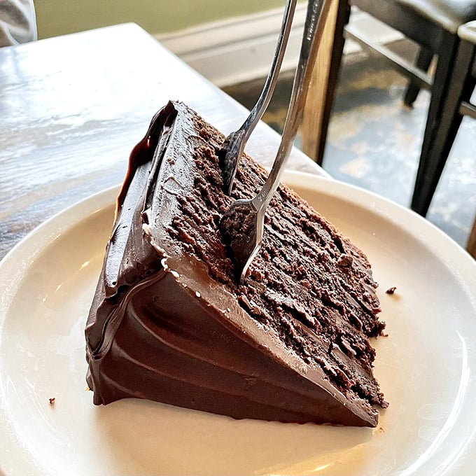 Chocolate cake so decadent it should require a permission slip. Each layer tells a story of cocoa devotion that's impossible to resist.