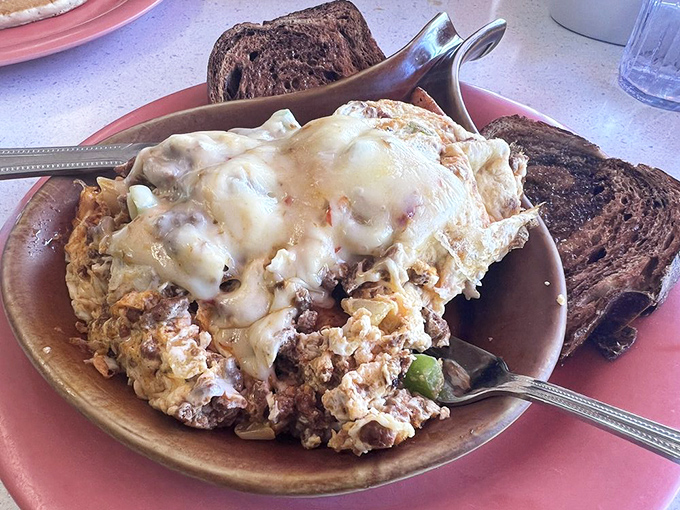 This isn't just an omelet&mdash;it's a masterpiece of morning architecture, draped in melted cheese and ready for its close-up.