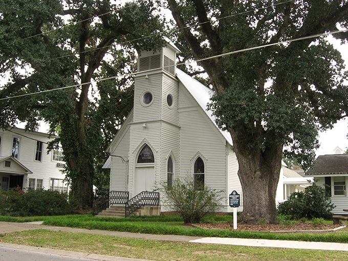 This charming white chapel has witnessed more life events than a wedding photographer. Simple, serene, and standing strong against time's relentless march.