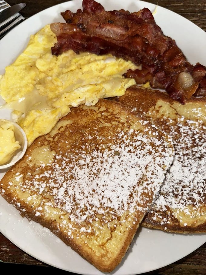 French toast that makes you question every other French toast you've ever eaten. Powdered sugar snowfall included at no extra charge.