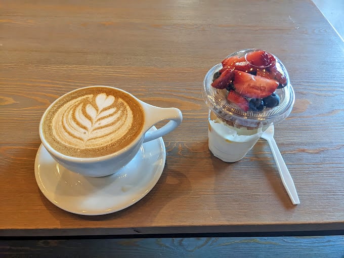 Coffee and berries&mdash;a pairing as natural as Oklahoma sunsets and country music. The latte art is just showing off at this point.