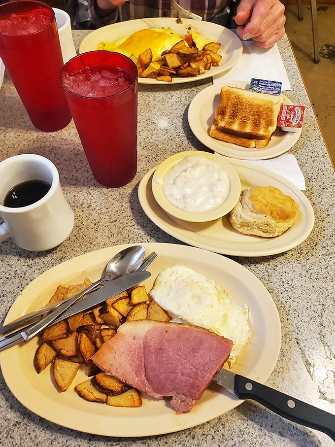 A breakfast spread that would make any road tripper pull over. Those red drinks aren't just beverages&mdash;they're the unofficial fuel of Route 66 adventures.