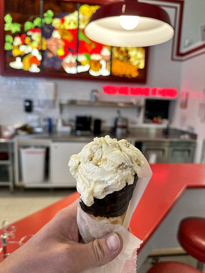 The classic waffle cone and vanilla scoop&mdash;sometimes the simplest pleasures are the most profound, especially against that colorful backdrop.