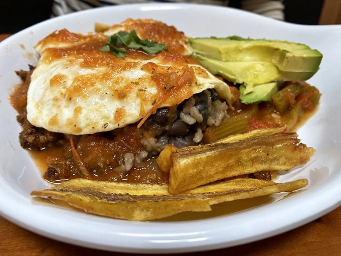 A breakfast that tells a story: eggs, avocado, and savory protein atop crispy tortillas&mdash;proof that morning meals deserve their own passports.