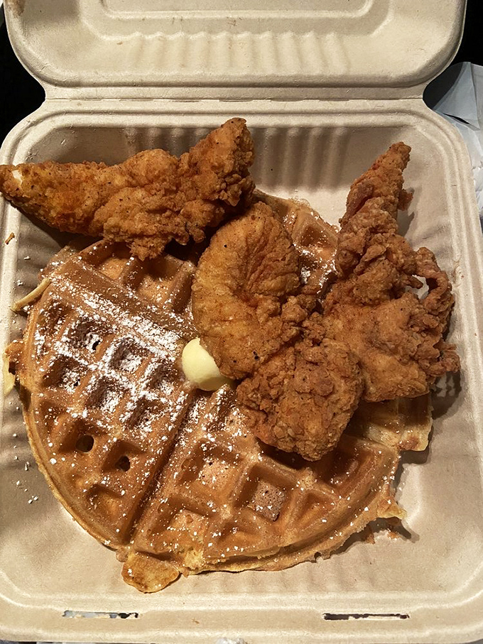 A waffle wearing a crown of crispy chicken. The butter melting into those perfect squares creates little pools of heaven.