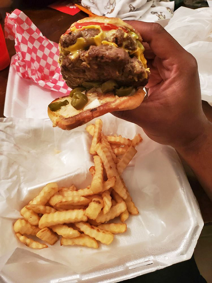 This isn't just a burger&mdash;it's a monument to American ingenuity. Melted cheese cascading over a juicy patty with pickles for that perfect tang.