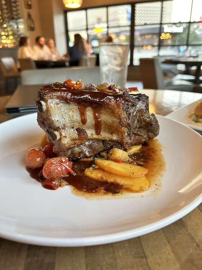 This pork chop isn't just dinner, it's architecture&mdash;a towering monument to protein that makes you want to cancel your evening plans.