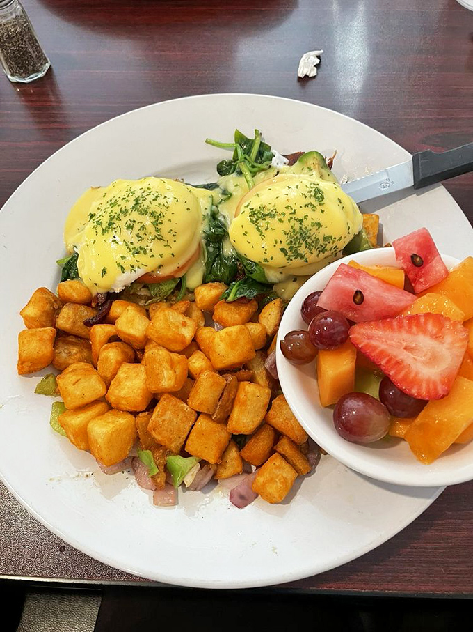 Eggs Benedict that belongs in the breakfast hall of fame&mdash;hollandaise so velvety it should be illegal, with a side of fresh fruit for "balance."