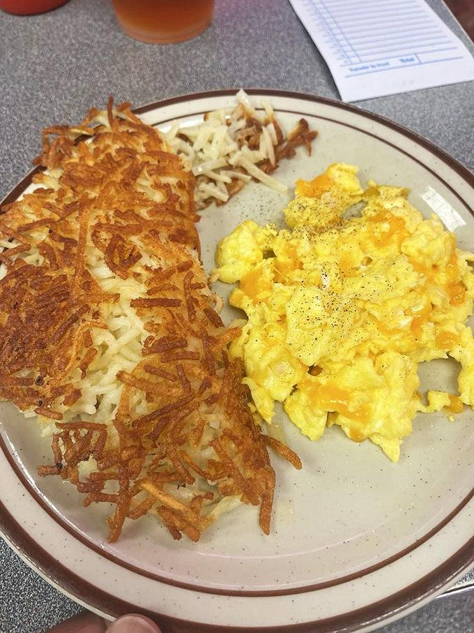 The Western omelet brings the flavor rodeo to town, while those hash browns ride alongside like a crispy, golden sidekick.
