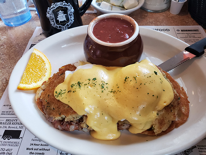 Eggs Benedict getting cozy with a side of strawberry jam&mdash;a breakfast romance that would make Julia Child swoon with delight.