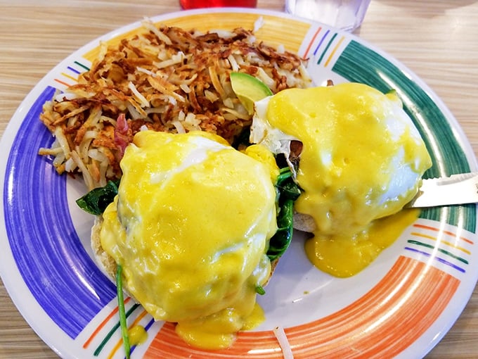 Eggs Benedict that would make a brunch snob weep with joy&mdash;perfectly poached eggs, vibrant hollandaise, and hash browns crisped to golden perfection.