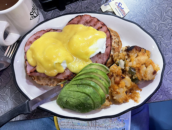 Eggs Benedict that doesn't need a filter&mdash;Canadian bacon, perfectly poached eggs, hollandaise that actually tastes homemade, and a side of avocado luxury.