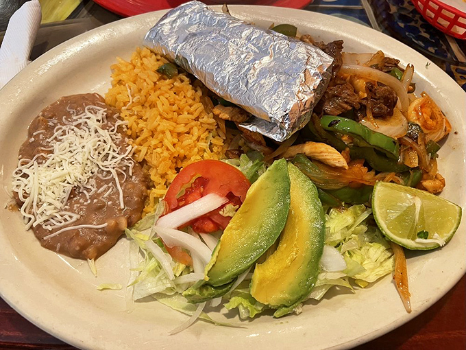 A protein paradise where steak, chicken, and shrimp coexist in perfect harmony. The avocado is just showing off at this point. 