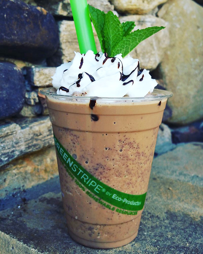 Whipped cream mountains, chocolate drizzle rivers, and a mint leaf flag planted at the summit. This frappe isn't just a drink&mdash;it's a dessert expedition.