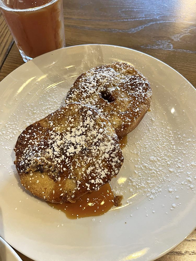 French toast dusted with powdered sugar &ndash; proof that simplicity, when done perfectly, can still make your taste buds stand and applaud.
