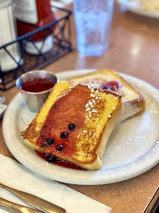 French toast that makes you question why you'd ever order anything else. Those blueberries aren't garnish&mdash;they're jewelry for your breakfast.