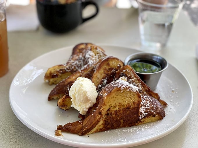 French toast that makes you understand why people wait in line for breakfast. That dusting of powdered sugar? The morning equivalent of fairy dust.