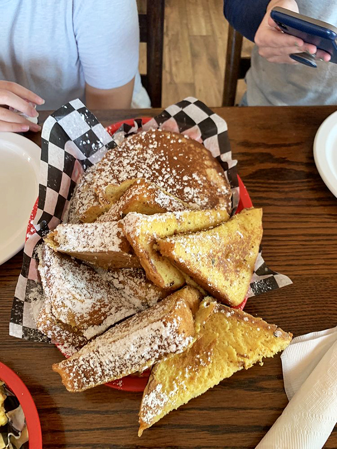 The French toast basket&mdash;where triangles of cinnamon-kissed goodness get a powdered sugar snowfall. Breakfast geometry never tasted so good.