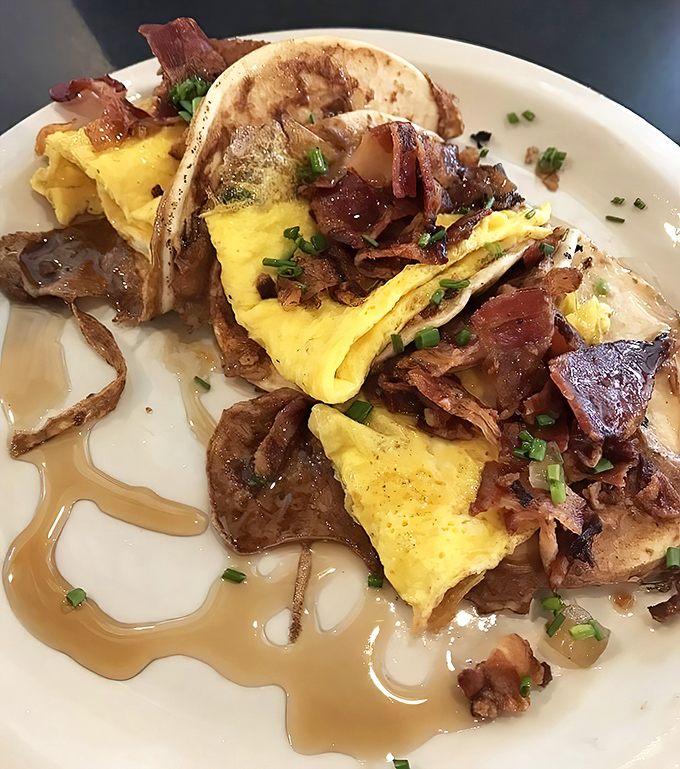 Breakfast tacos that prove tortillas deserve morning glory too. Scrambled eggs and bacon nestled in French toast battered flour tortillas&mdash;genius!