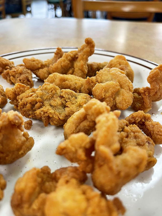 Golden-fried alligator&mdash;because sometimes the most delicious bites come from creatures you wouldn't want to meet while swimming.