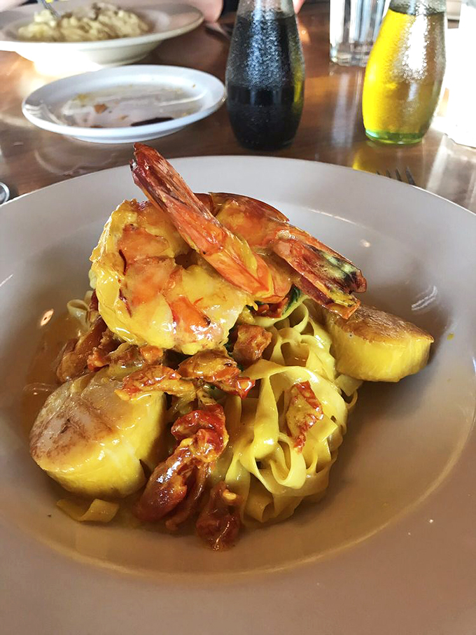 Seafood pasta that makes you wonder if mermaids moonlight as sous chefs. Those prawns aren't just garnish&mdash;they're the crown jewels of this oceanic treasure.