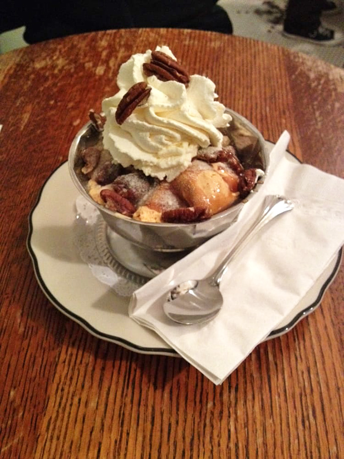 A mountain of ice cream and toppings that would make Everest climbers reconsider their life choices. 