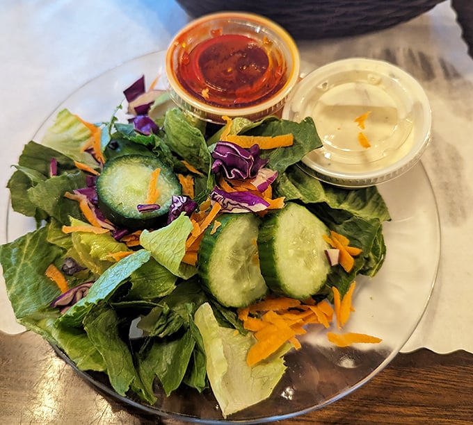 Even the salad looks happy to be here &ndash; a fresh, colorful prelude to the main fish attraction.