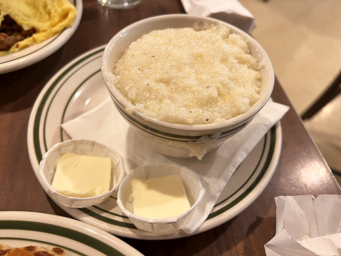 Southern comfort in a bowl&mdash;these grits with twin pats of butter stand ready to transform your morning from ordinary to extraordinary.